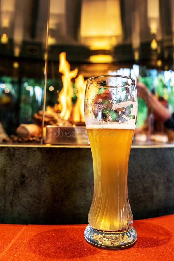 Glass of Light Beer in a Dark Pub Stock Image - Image of beverage ...