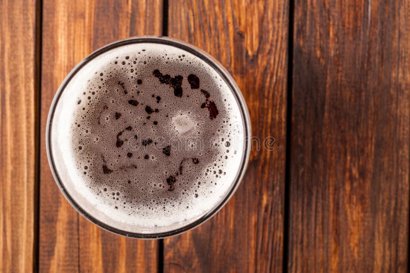 Glass of Light Beer on an Old Wooden Table. Top View Stock Photo ...