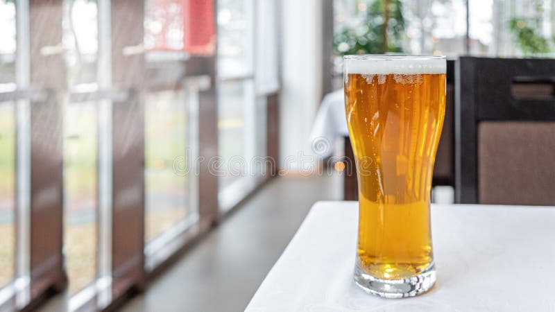 Glass of Light Beer on a Table in a Bar Stock Photo - Image of cafe ...