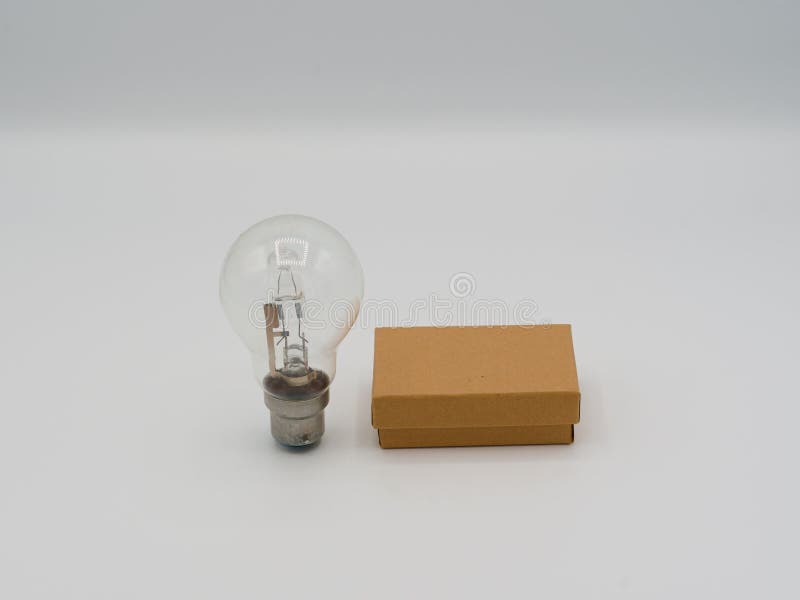 Glass Light Bulb and Brown Box in a White Surround Stock Photo - Image ...