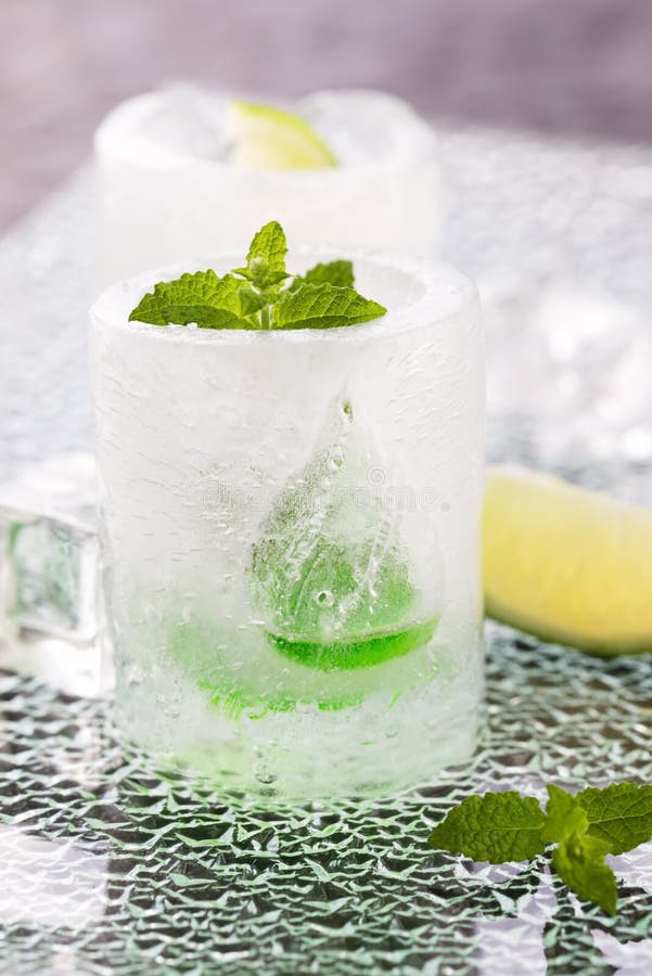 Glass Made of Ice with Vodka, Lemon and Mint Stock Image - Image of ...