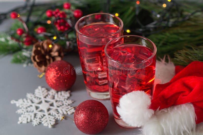 Glass of Mango Dragonfruit Refresher Drink on Table with Ice Cubes ...