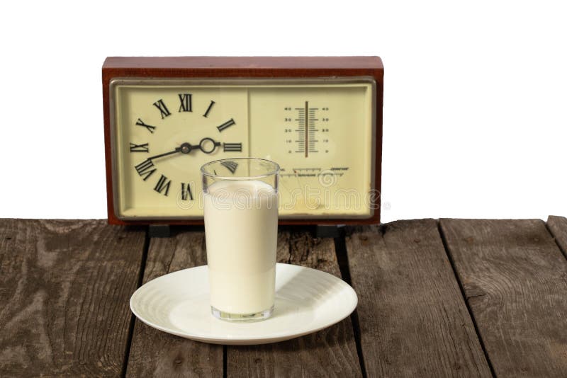 Glass of Milk and Old Clock on a Wooden Table Stock Image - Image of ...