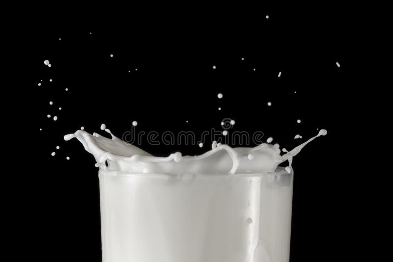 A Glass of Milk with Splashes. a Glass of Milk on Black Stock Image ...