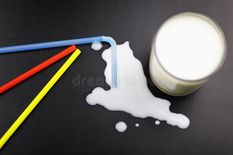 Glass of Milk Splashing and Tube Straw on Table Stock Image - Image of ...