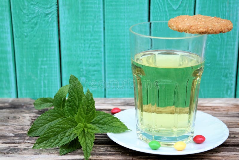 Glass of Mint Tea with Turquoise Background and Text Space Stock Photo ...