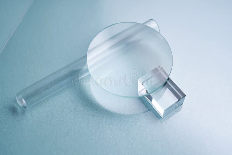 Glass Objects and Prisms on a Blue Background. Stock Photo - Image of ...