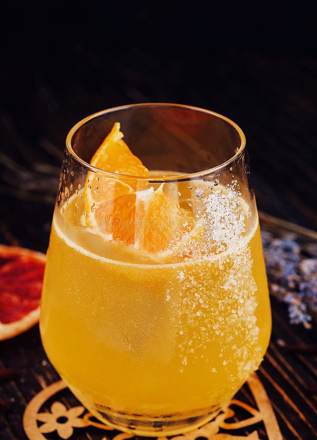 Glass of Orange Alcoholic Drink with Ice and Slice of Orange Stock ...