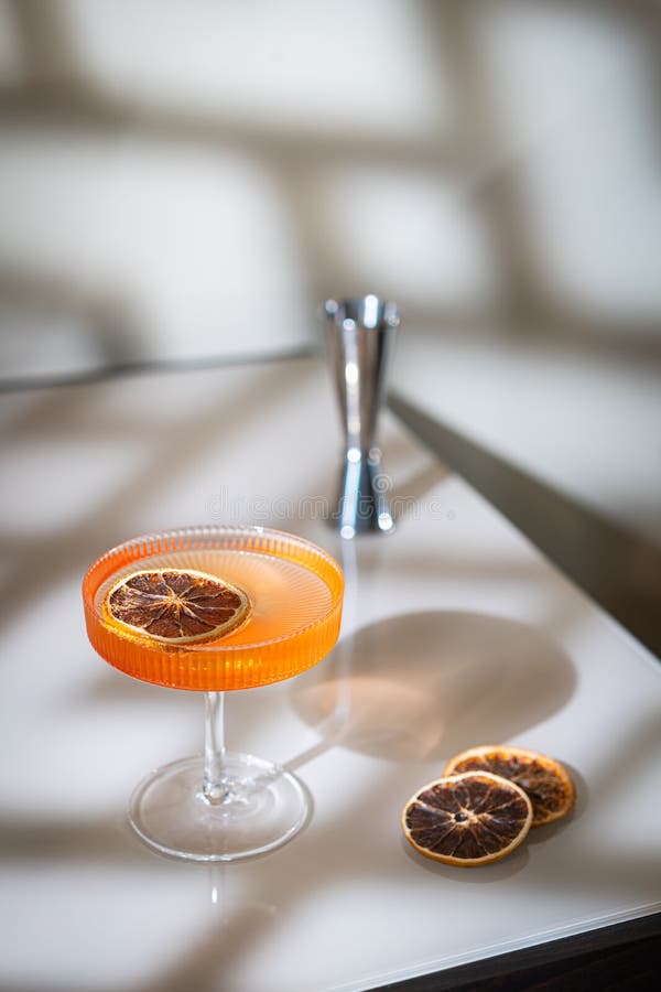 Glass of orange cocktail stock photo. Image of orange - 242342990
