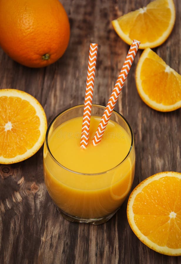 Glass of orange juice stock photo. Image of straw, juicy - 87502836