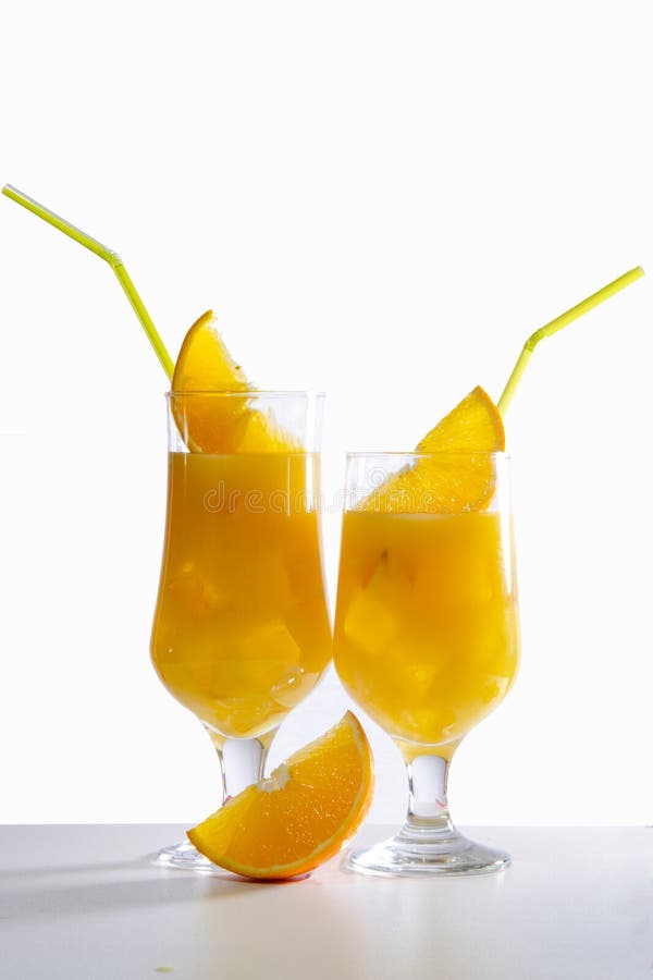 A Glass With Orange Juice Fruit Slices Ice Sliced Orange On A White Table Stock Image Image