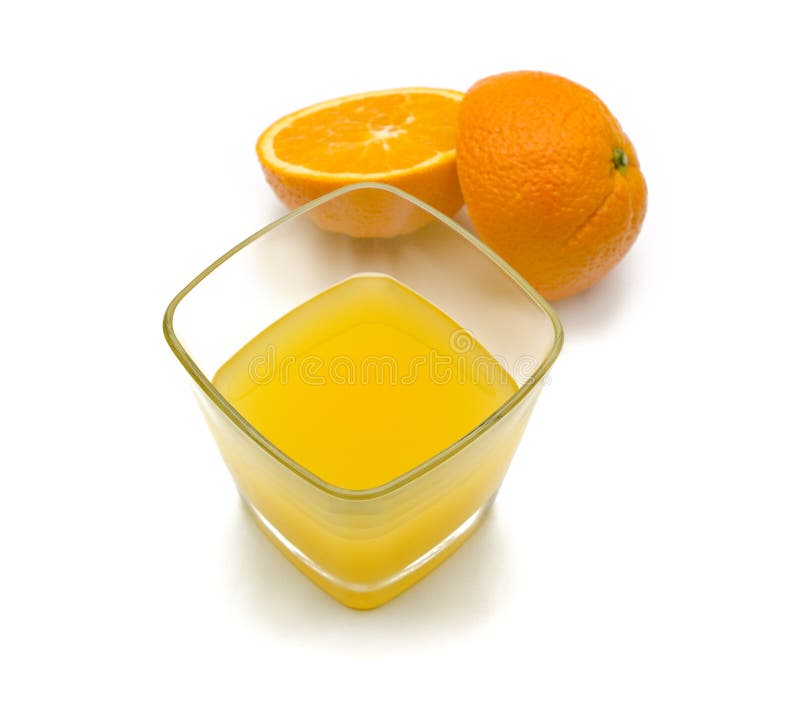 Glass with Orange Juice Inside and an Orange Split into Two Pieces ...