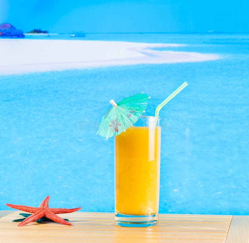 Glass Of Orange Juice On The Sandy Beach Stock Photo - Image of cold ...
