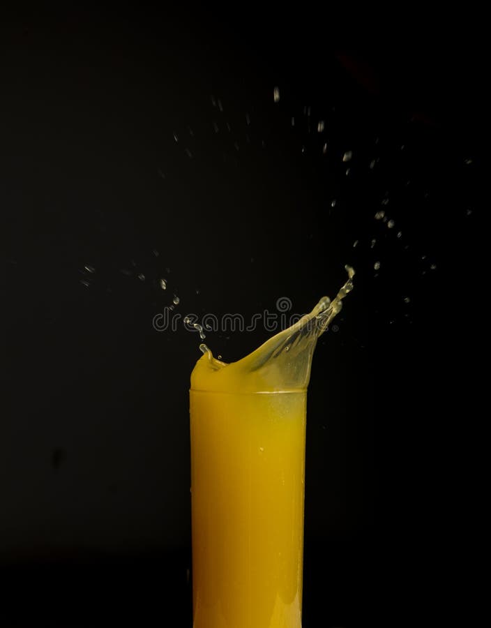 Glass of Orange Juice with Splash, on Black Background Stock Photo ...