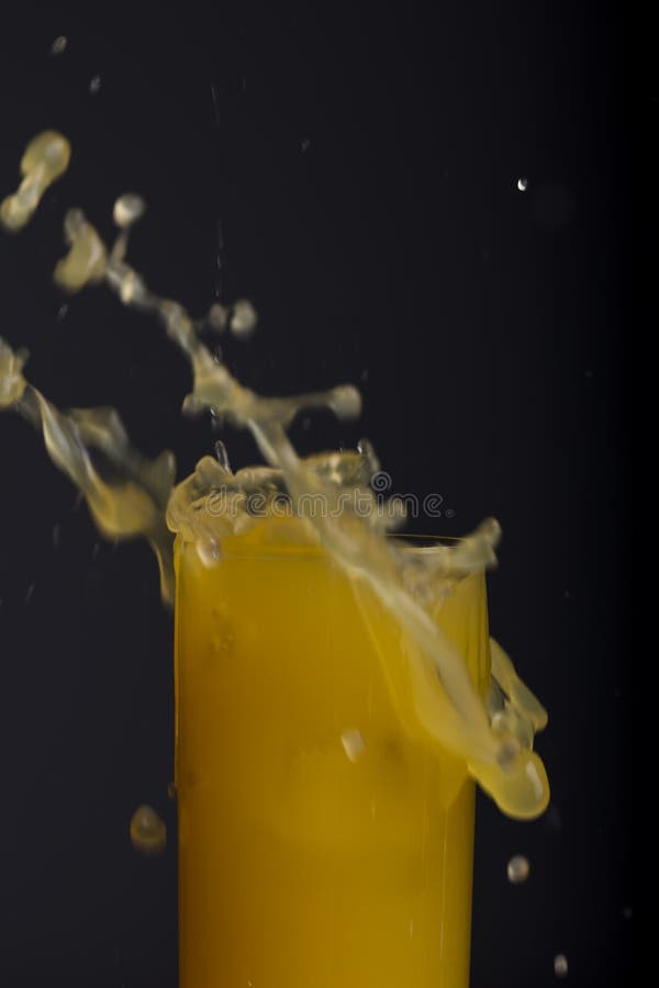 Glass of Orange Juice with Splash, Isolated on Black Background Stock ...