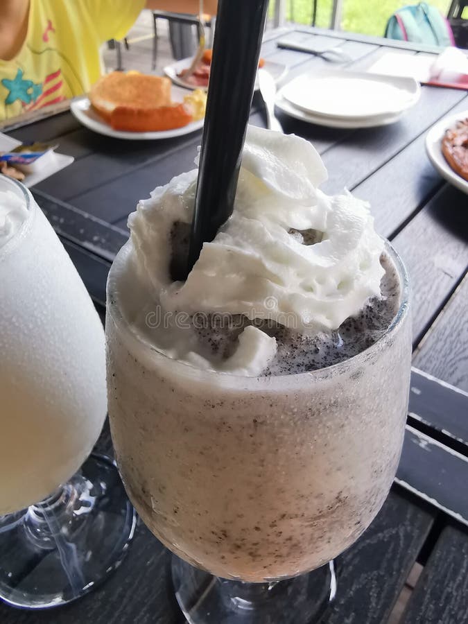A glass of oreo milkshake stock image. Image of sweetness - 195601645