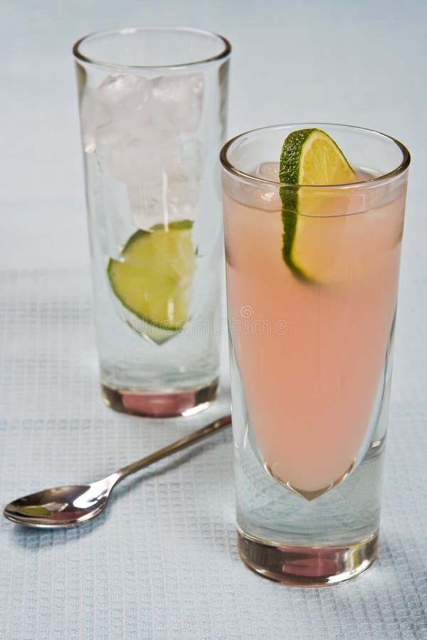 Glass of Pink Grapefruit Juice with Lime Stock Photo - Image of luxury ...
