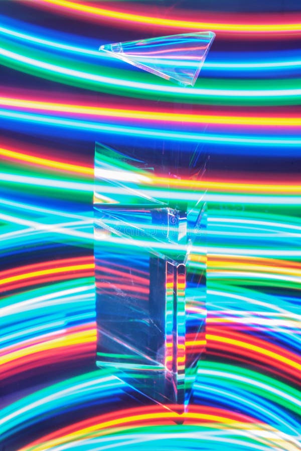 Glass Prism with Reflection on a Abstract Red and Yellow Neon Light ...