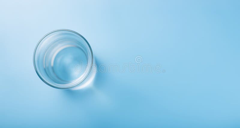 Glass of Pure Cold Water on a Blue Background Stock Photo - Image of ...