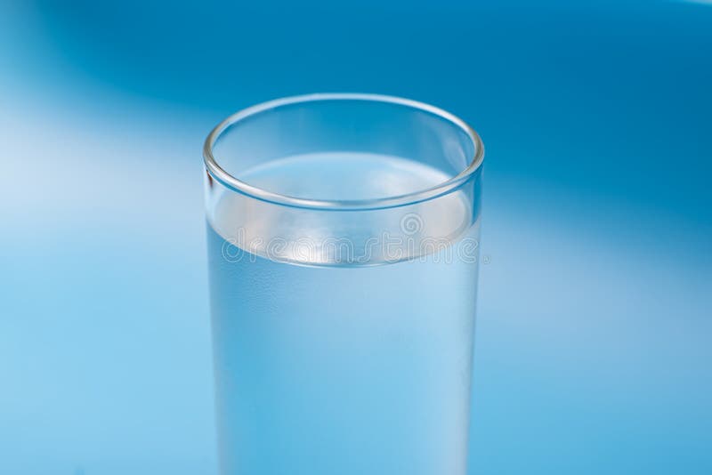 Glass of Pure Cold Water on a Blue Background Stock Image - Image of ...