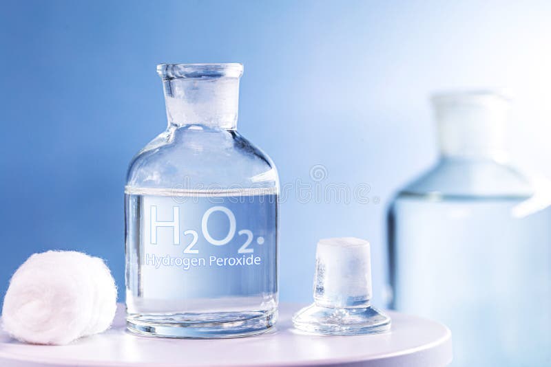 Glass of Pure Hydrogen Peroxide, H2O2, with a Piece of Cotton on the ...