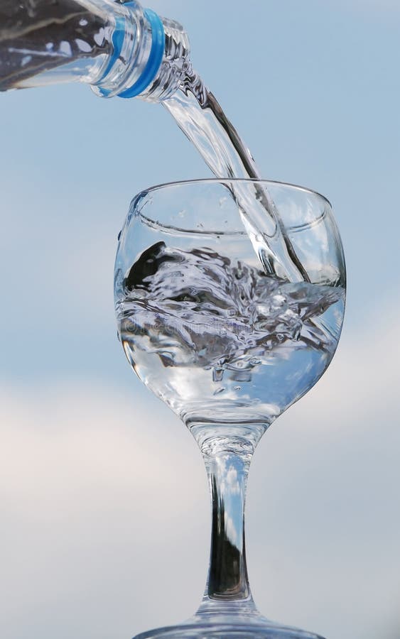 Pure Water Splashing from Bottle into Glass Stock Photo - Image of drop ...