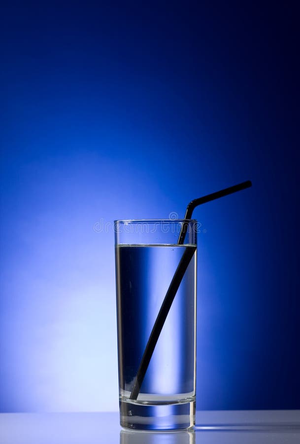 Glass with Pure Water with a Straw on a Blue Stock Photo - Image of ...