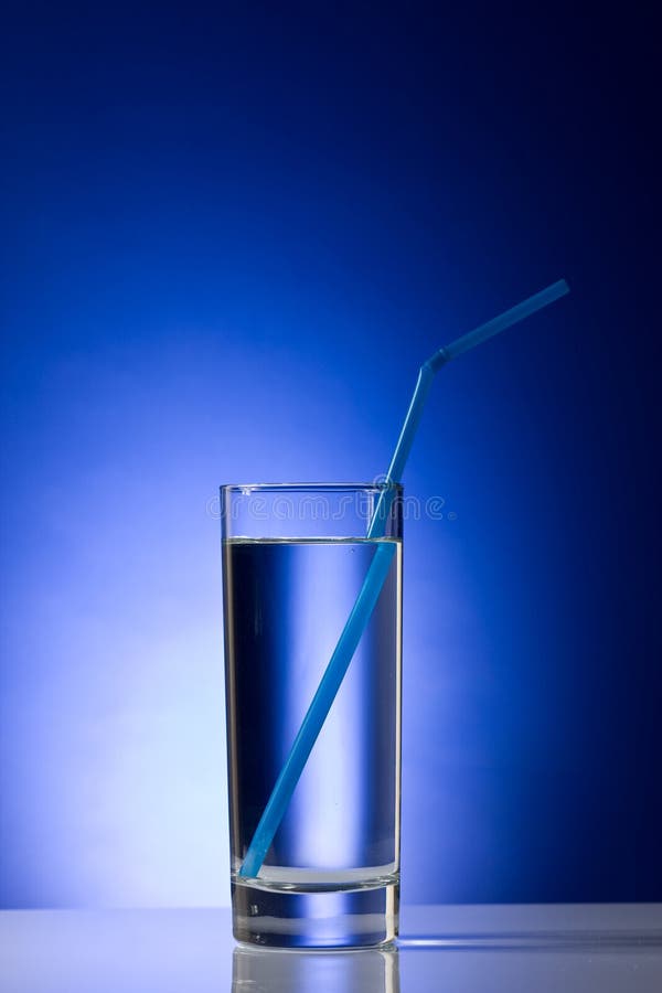 Glass with Pure Water with a Straw on a Blue Stock Photo - Image of ...
