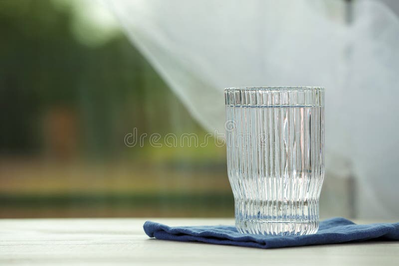 Glass of Pure Water on White Table, Space for Text Stock Photo - Image ...