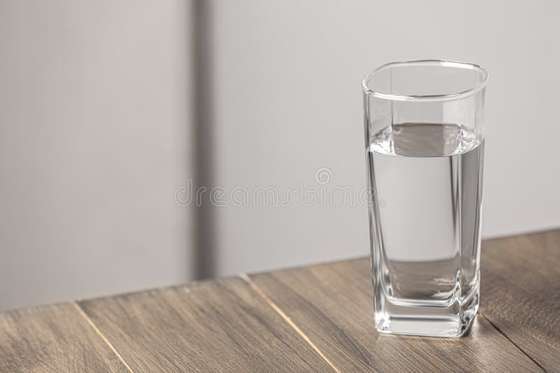 Glass of Pure Water on Wooden Table Indoors, Space for Text Stock Photo ...