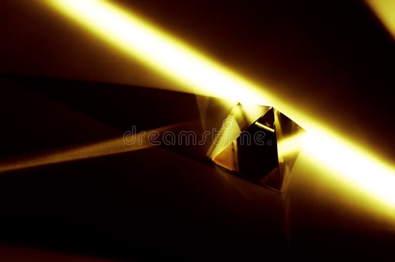 Glass Pyramid in Abstract Yellow Light Stock Photo - Image of lens ...