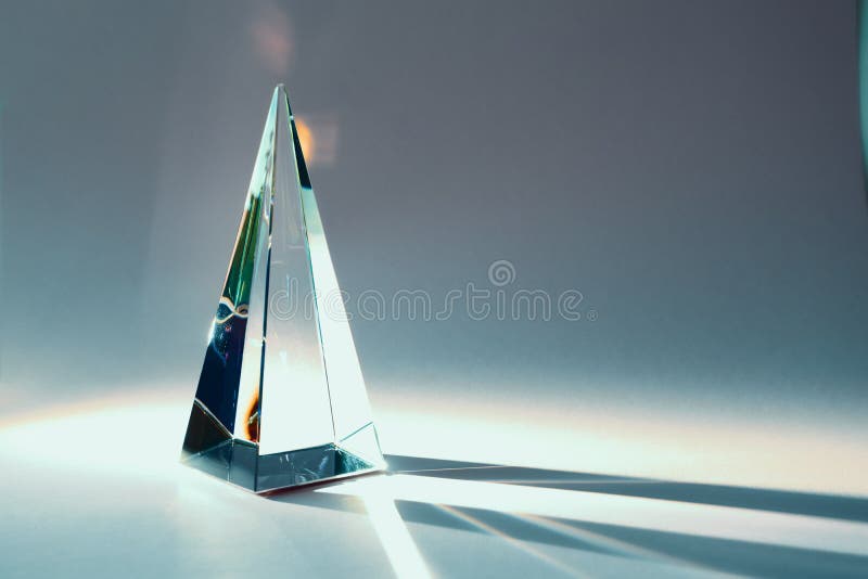 Glass Pyramid Prism with Colorful Sunlight Reflection on Background ...