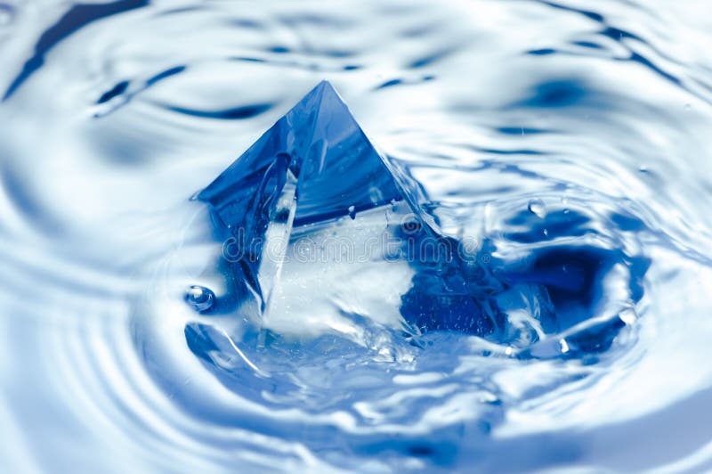 Glass pyramid in water stock photo. Image of pyramid - 251585534