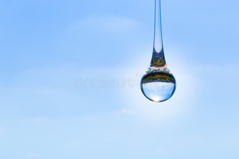 Glass raindrop on blue sky stock photo. Image of reflection - 60882426