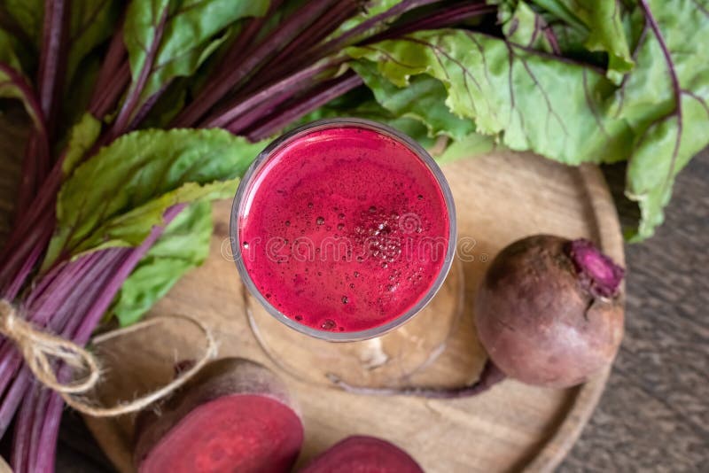 A Glass of Red Beet Juice with Fresh Beetroot Stock Photo - Image of ...