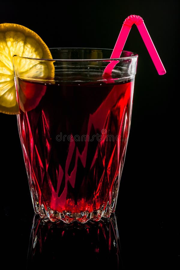 A Glass with Red Drink on a Dark Background. Stock Image - Image of ...