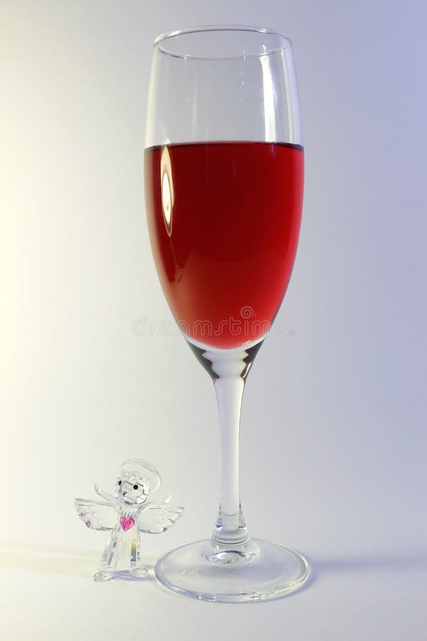 A Glass of Red Raspberry Wine and Angel Stock Photo - Image of ...