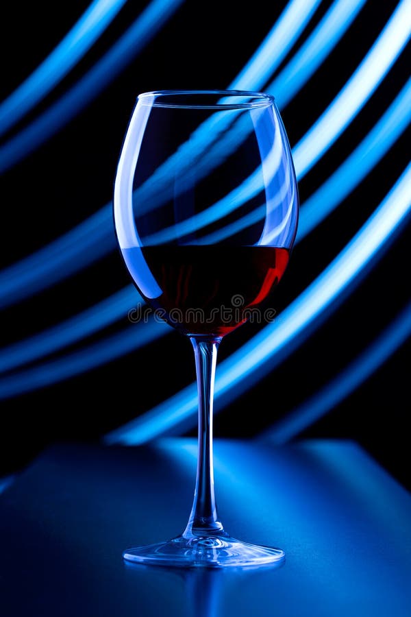 Glass with Red Wine on a Background of Abstract Lines of Light Stock ...