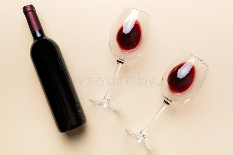 Glass of Red Wine and a Bottle on Colored Table. Flat Lay, Top View Wth ...
