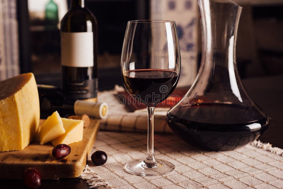 Glass of Red Wine with Cheese and Grapes on a Table Stock Photo - Image ...