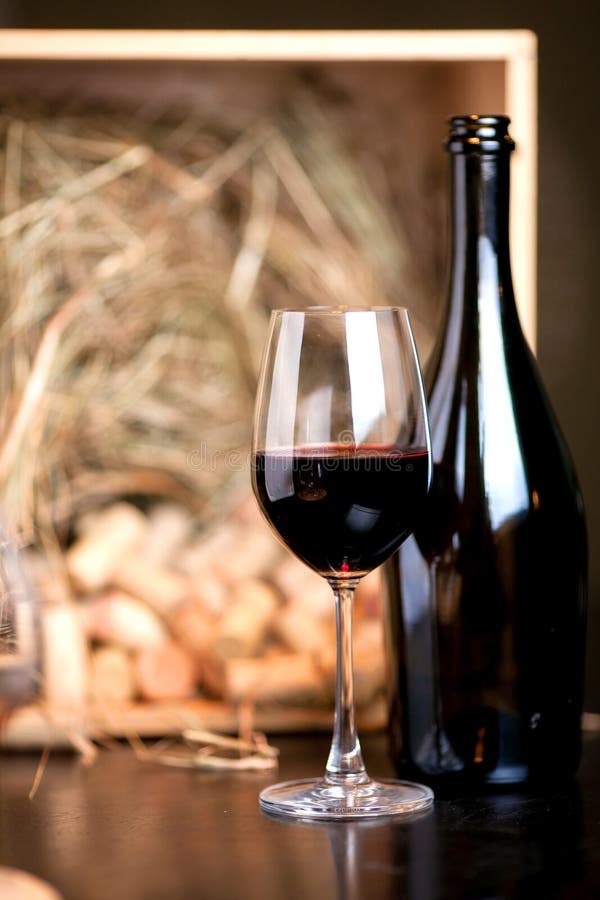 Glass of Red Wine with a Dark Bottle Stock Image - Image of celebration ...