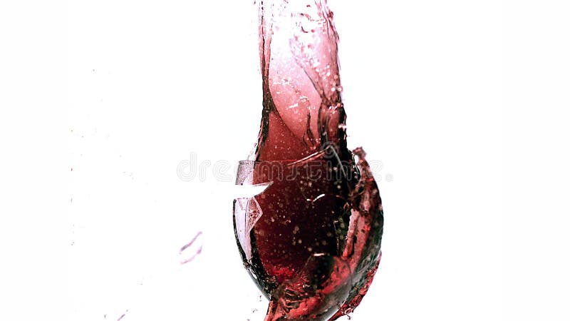 Glass of Red Wine Exploding and Splashing Against White Background ...