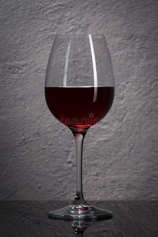 Glass. Red Wine Glass in Front of Stone Granite Wall Stock Image ...