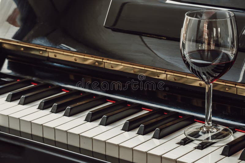 Glass of Red Wine on Piano Keyboard. Music and Wine Concept Stock Photo ...