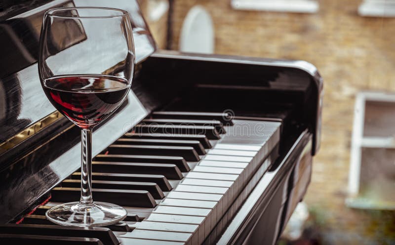 Glass of Red Wine on Piano Keyboard. Music and Wine Concept Stock Image ...