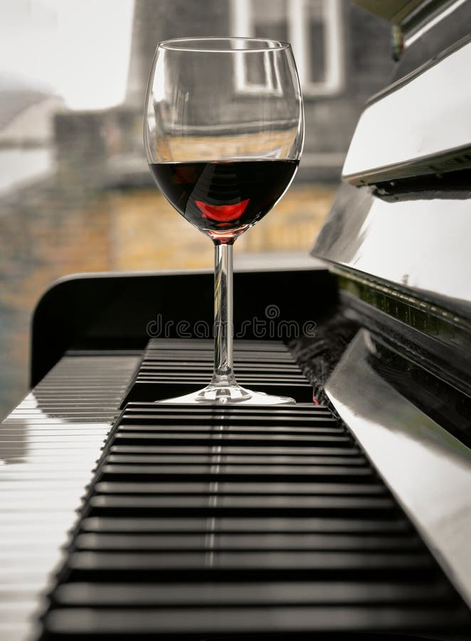 Glass of Red Wine on Piano Keyboard. Music and Wine Concept Stock Image ...