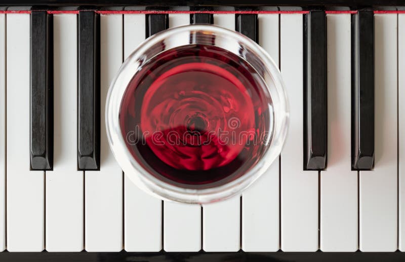 Glass of Red Wine on Piano Keyboard. Music and Wine Concept Stock Photo ...