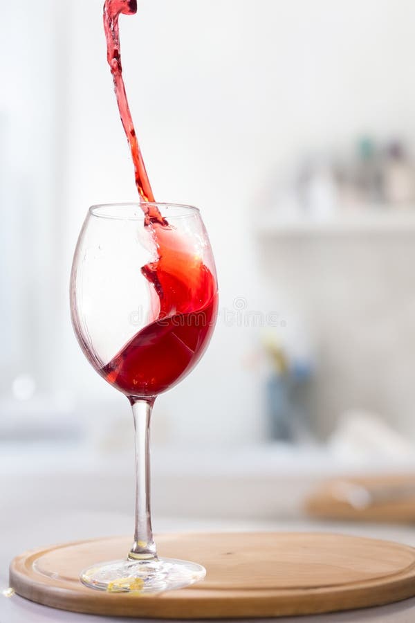 Glass of Red Wine with Splashes on White Stock Image - Image of splash ...
