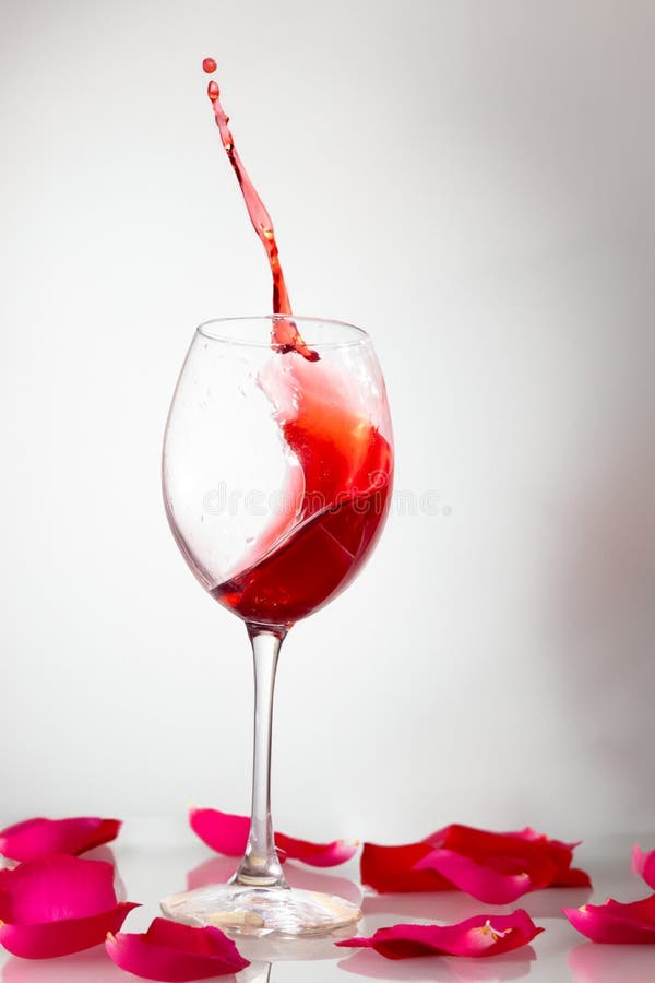 Glass of Red Wine with Splashes on White Stock Photo - Image of ...
