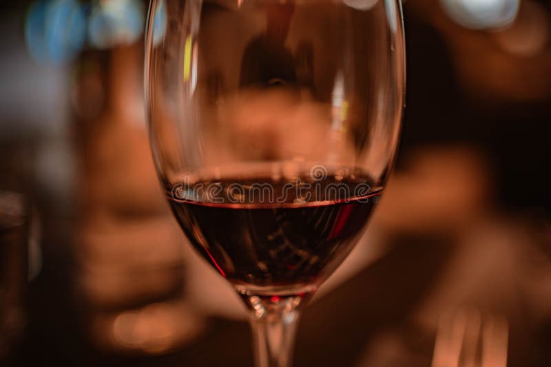 Glass of Red Wine on a Table in a Modern Restaurant Setting Stock Photo ...